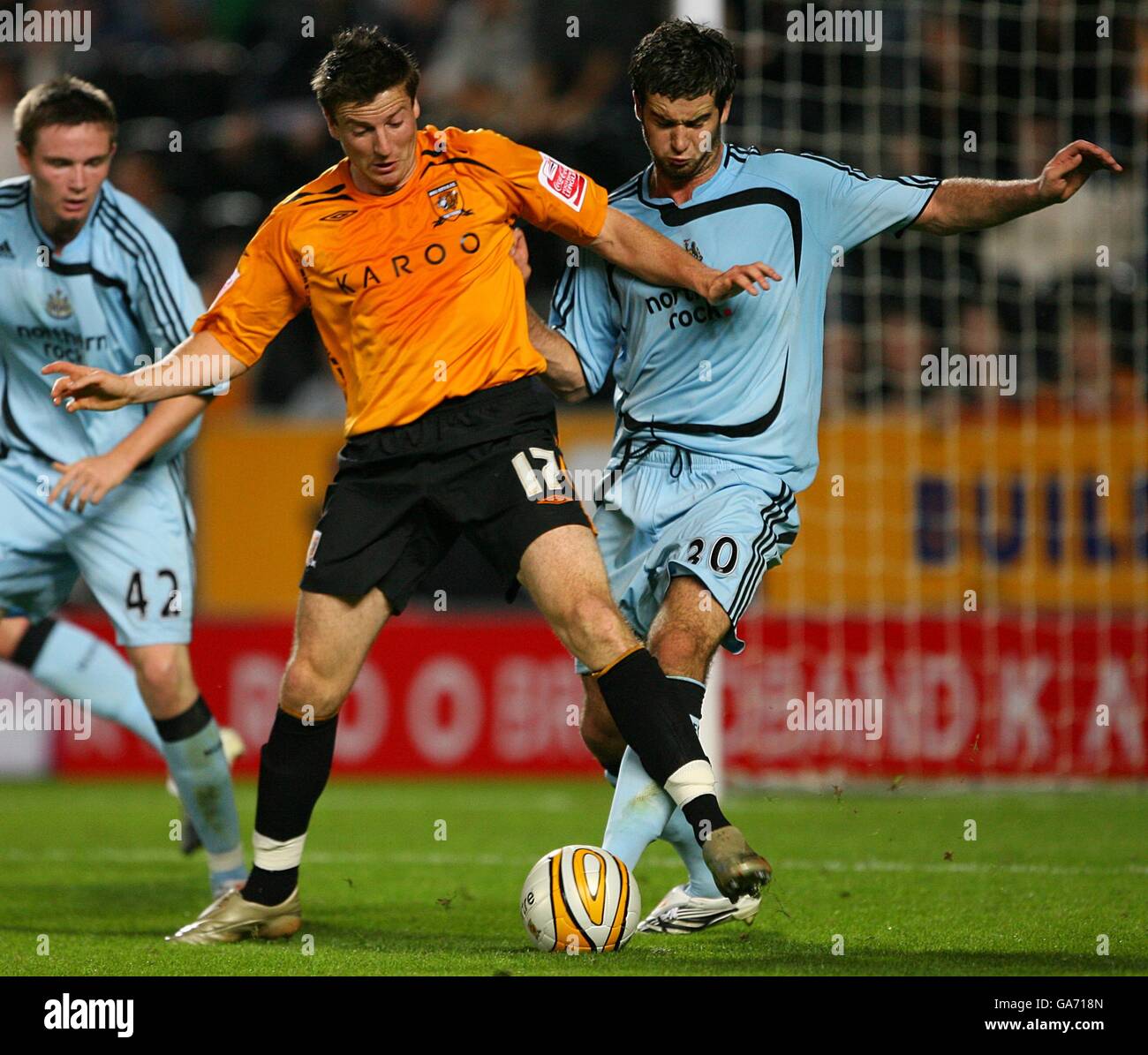Hull City's Michael Bridges (left) and Newcastle United's David Edgar ...