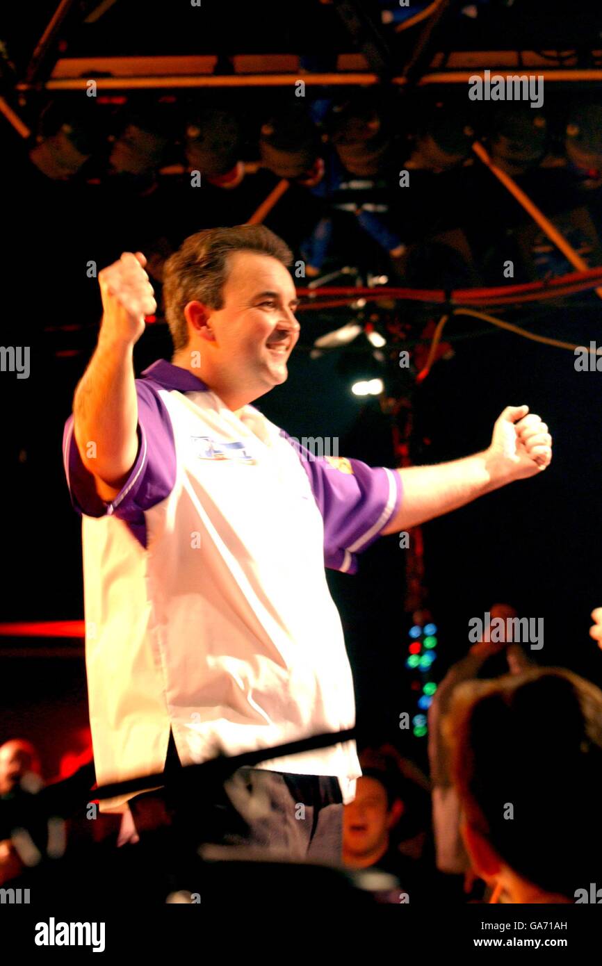 Phil Taylor celebrates on his winning throw as he wins the Darts World ...