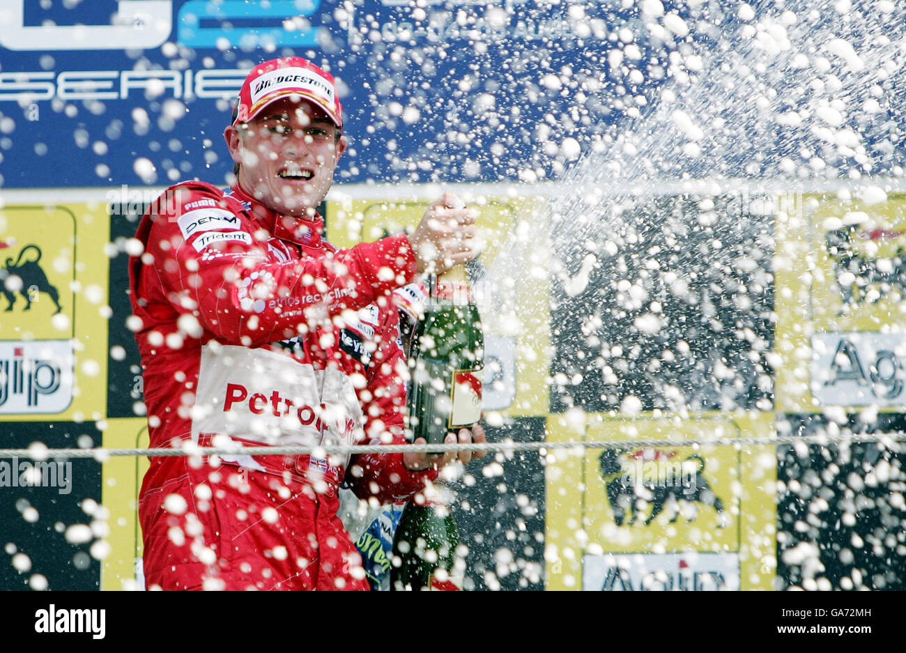 Northern Ireland's Adam Carroll celebrates his second place in the GP2 ...