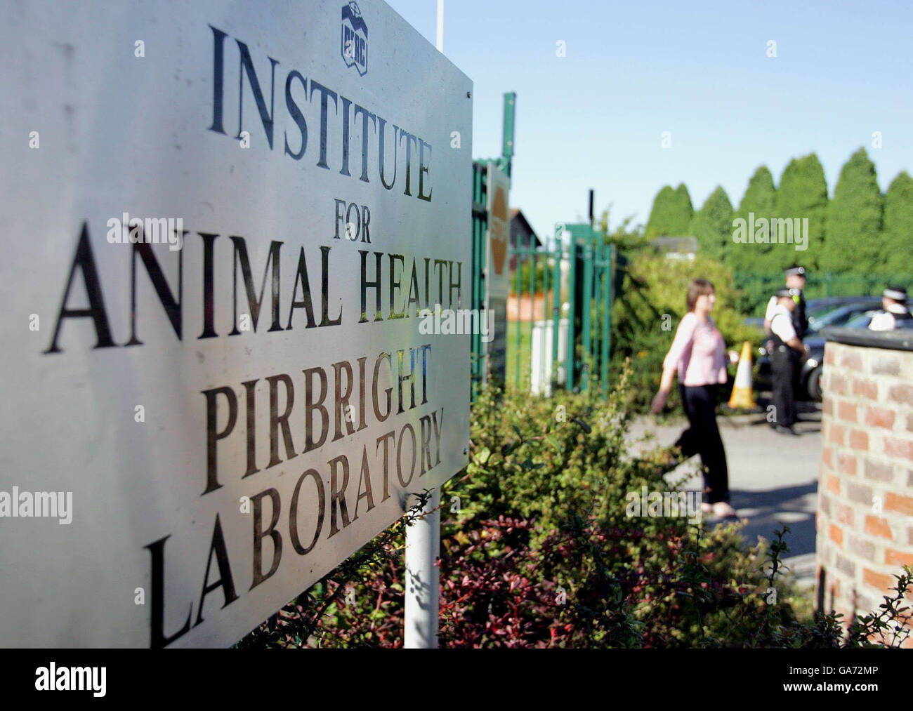 Police officers outside the Institute for Animal Health in Pirbright ...