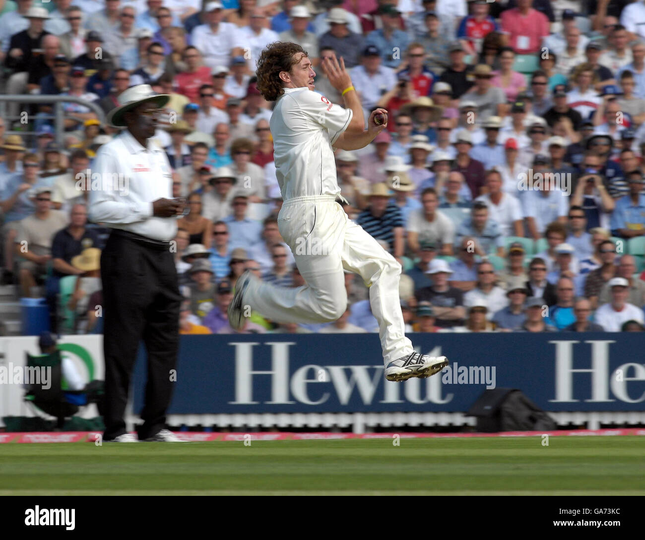 Full length action jumping bowling england mangrs hi-res stock ...