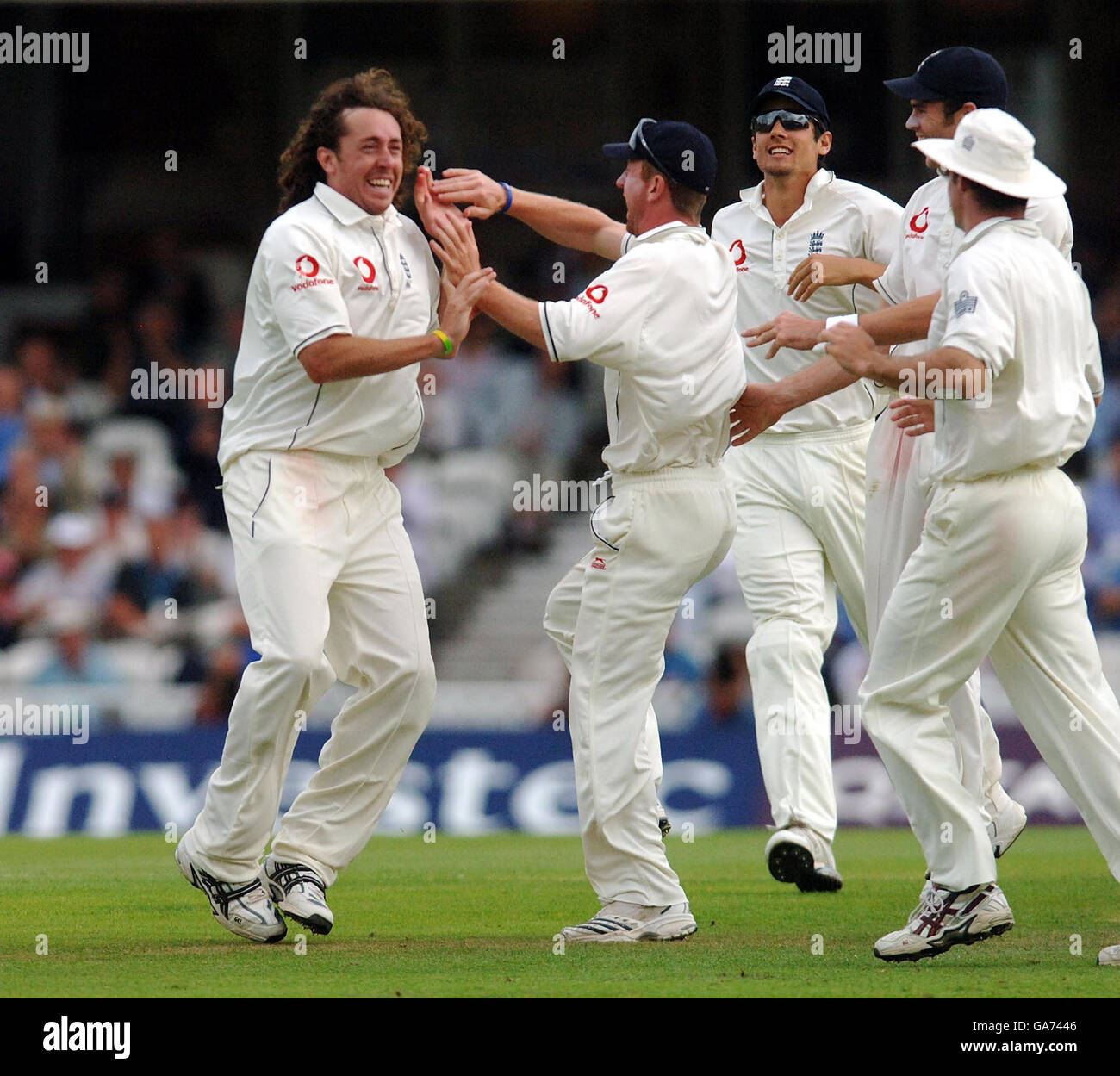 England's Ryan Sidebottom (left) celebrates bowling India's Dinesh ...