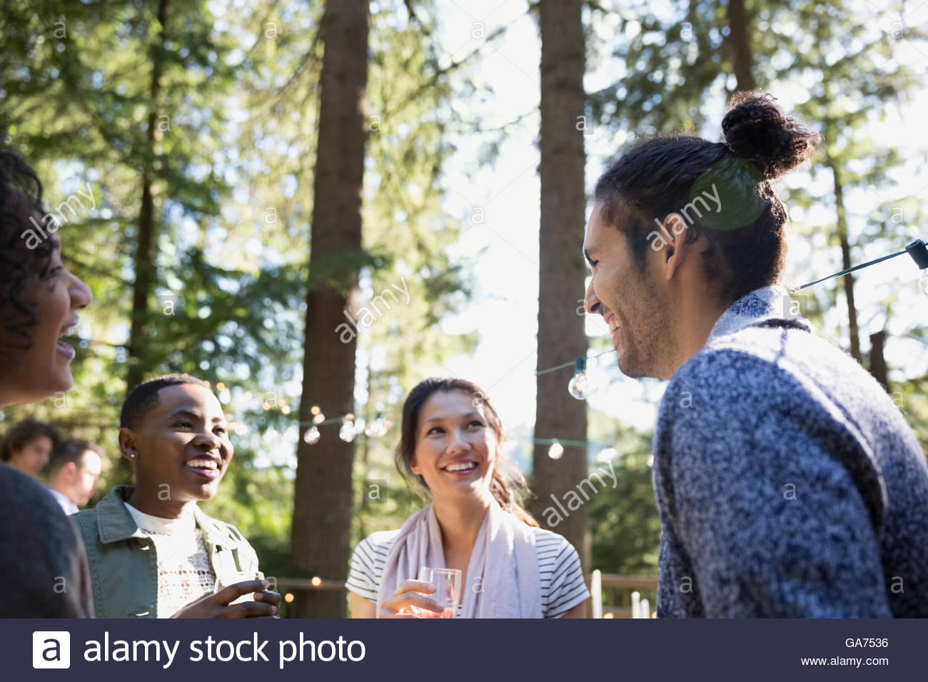 Friends talking and laughing at wedding reception Stock Photo - Alamy