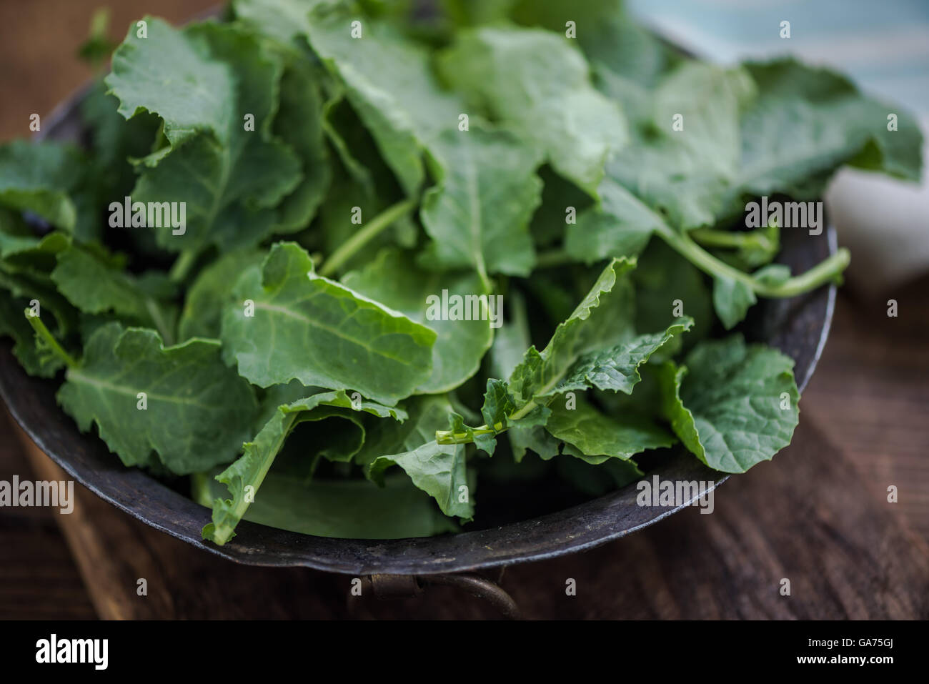 baby kale leaves in rustic bowl Stock Photo - Alamy