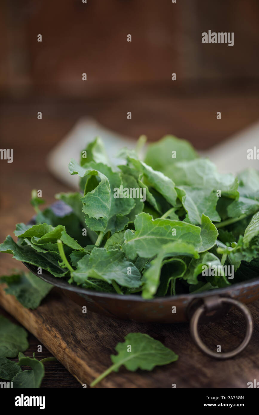 baby kale leaves in rustic bowl Stock Photo - Alamy