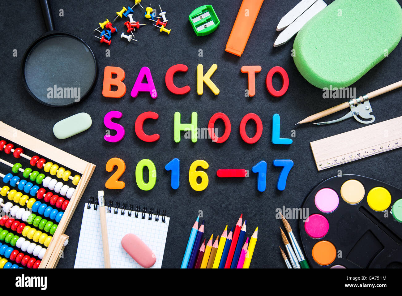 school supplies on black chalkboard. New year term concept Stock Photo ...