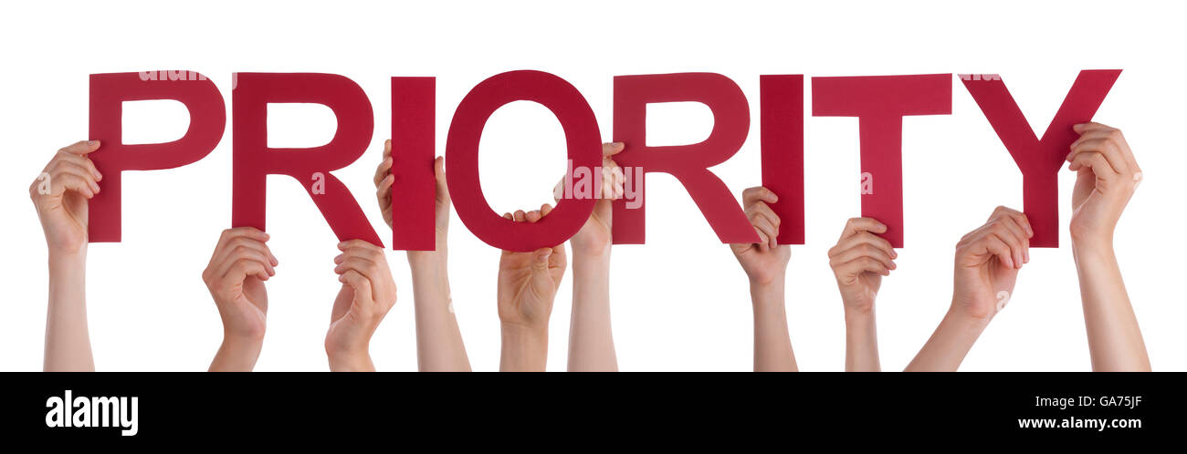 Many People Hands Holding Red Straight Word Priority Stock Photo - Alamy