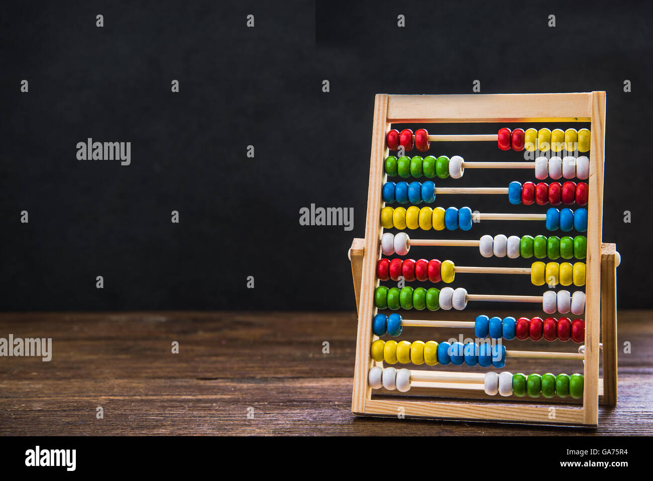 retro abacus in classroom agains black empty chalkboard Stock Photo - Alamy