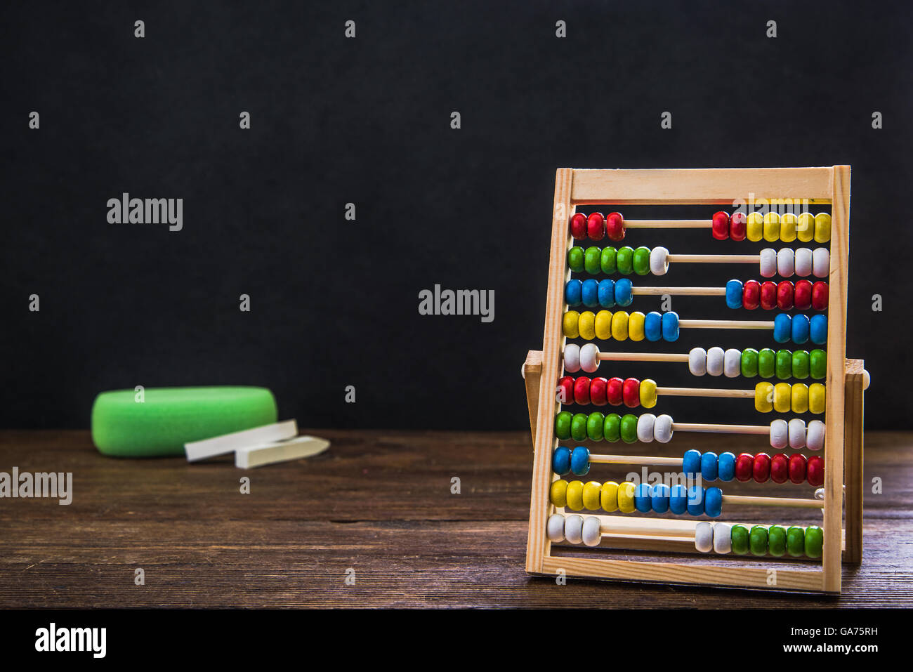 retro abacus in classroom agains black empty chalkboard Stock Photo - Alamy