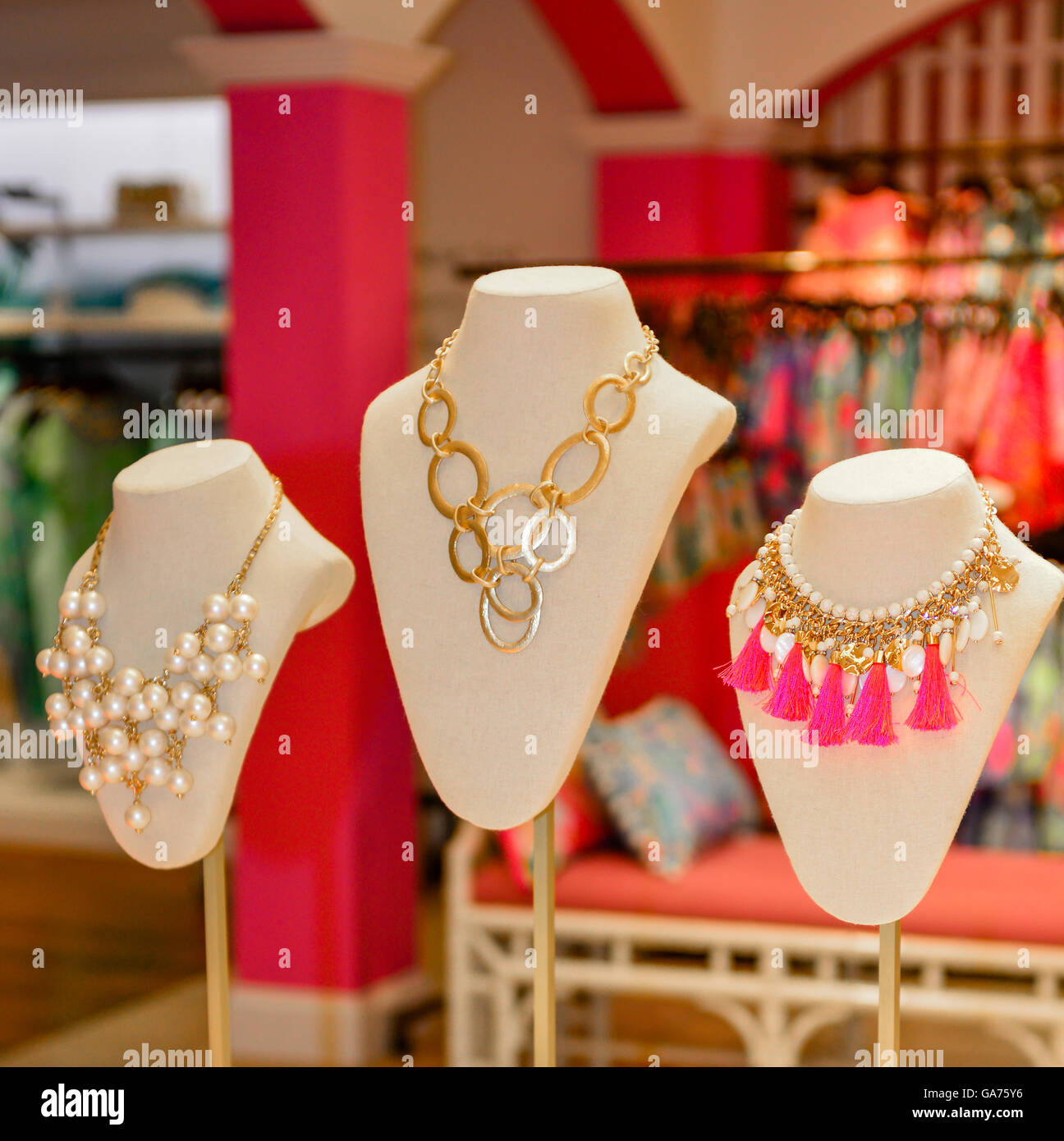 Three fashion necklaces on neck form displays inside Lilly Pulitzer's ...