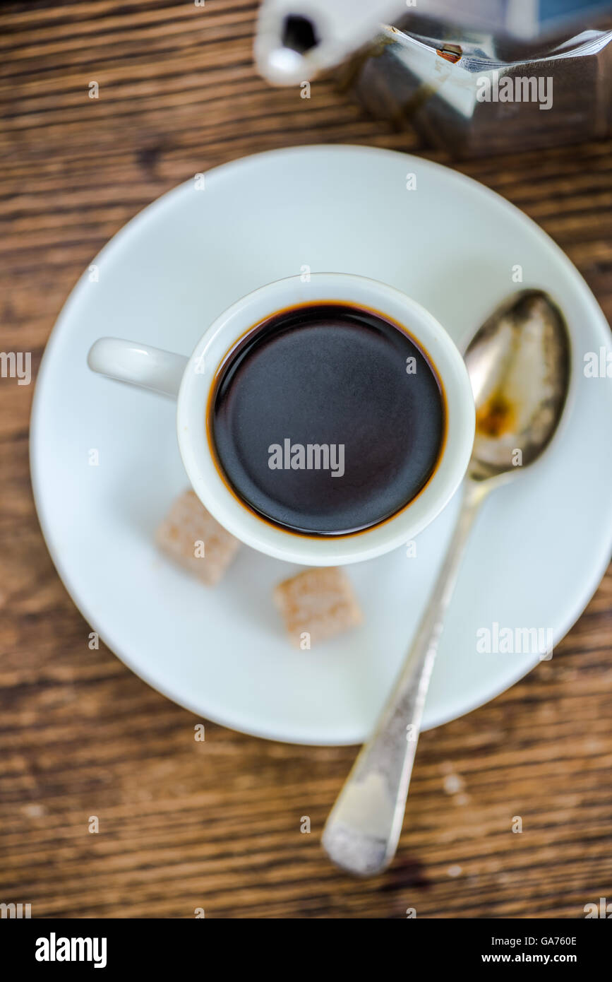 espresso cup, overhead view, wooden table background Stock Photo - Alamy