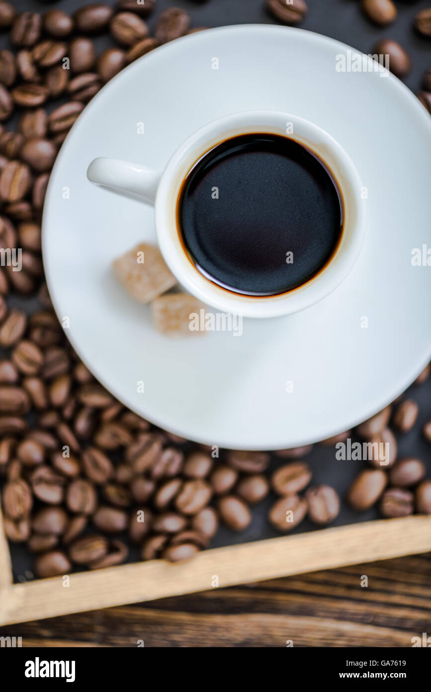 espresso coffee on roasted coffee beans, overhead view Stock Photo - Alamy