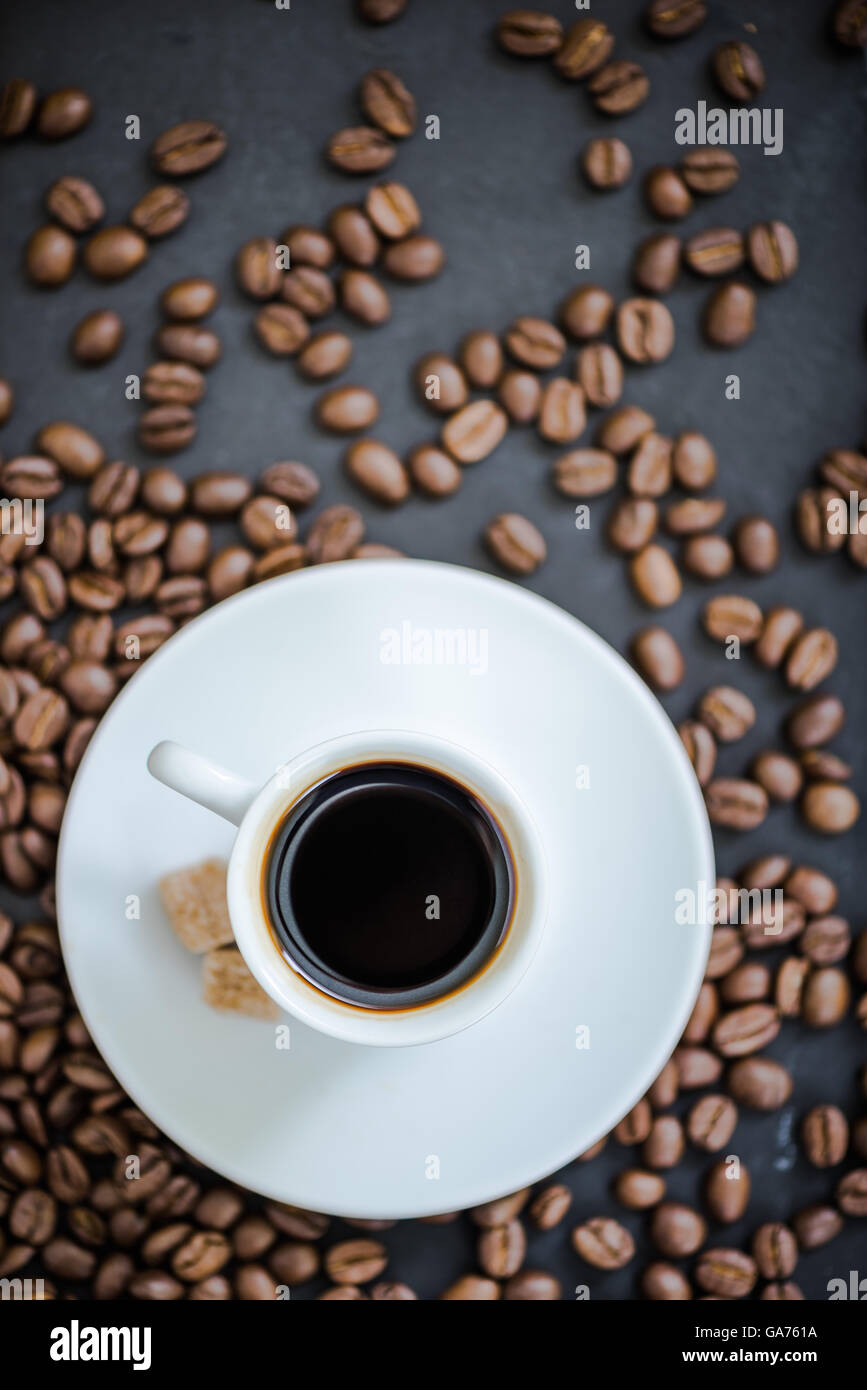 espresso coffee on roasted coffee beans, overhead view Stock Photo - Alamy