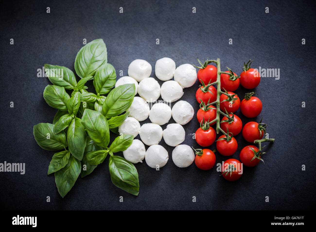 Italian flag made of fresh food on dark slate Stock Photo - Alamy
