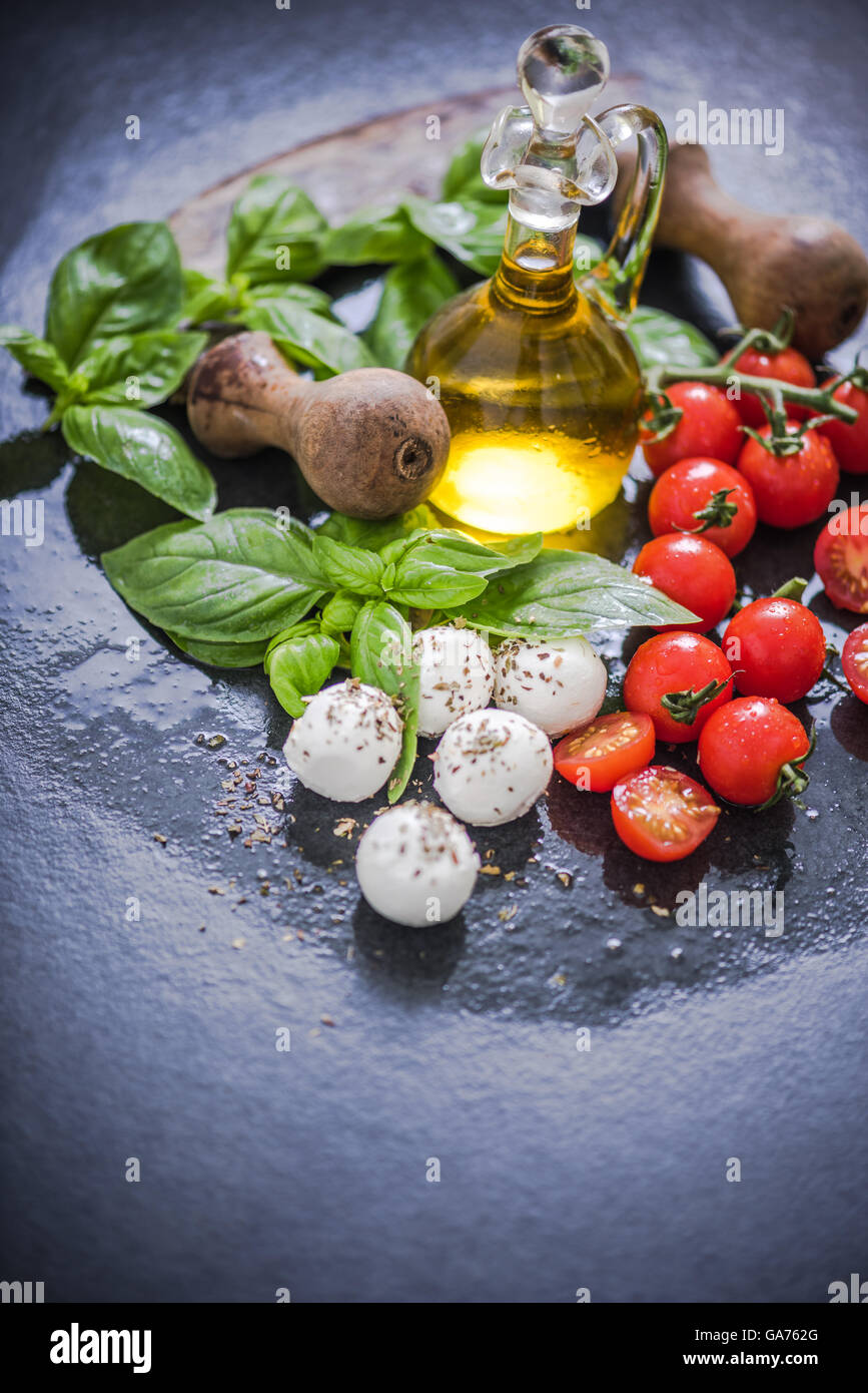 fresh italian food ingredients on dark slate Stock Photo - Alamy