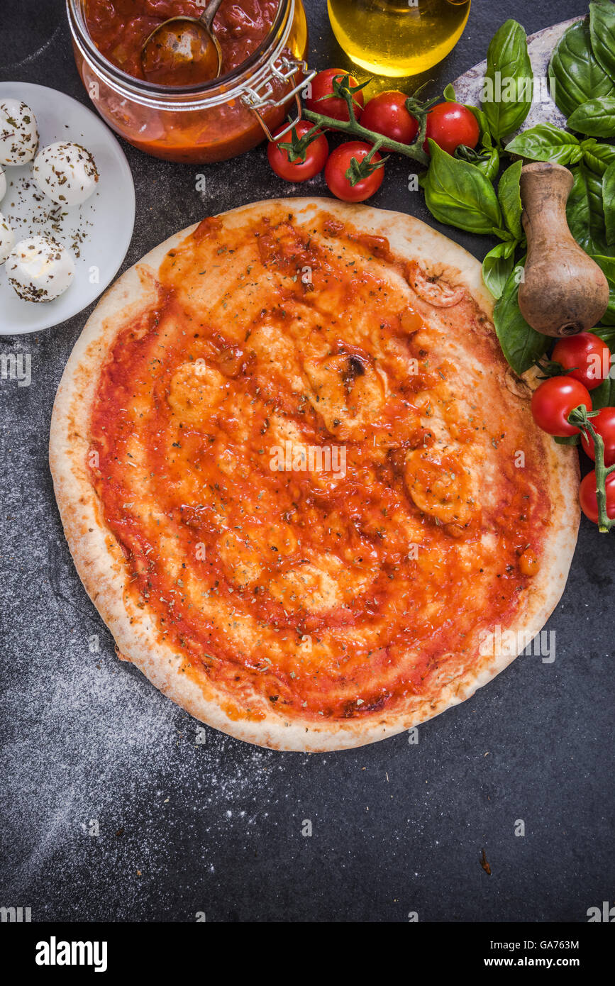 Making traditional italian pizza with fresh ingredients Stock Photo - Alamy