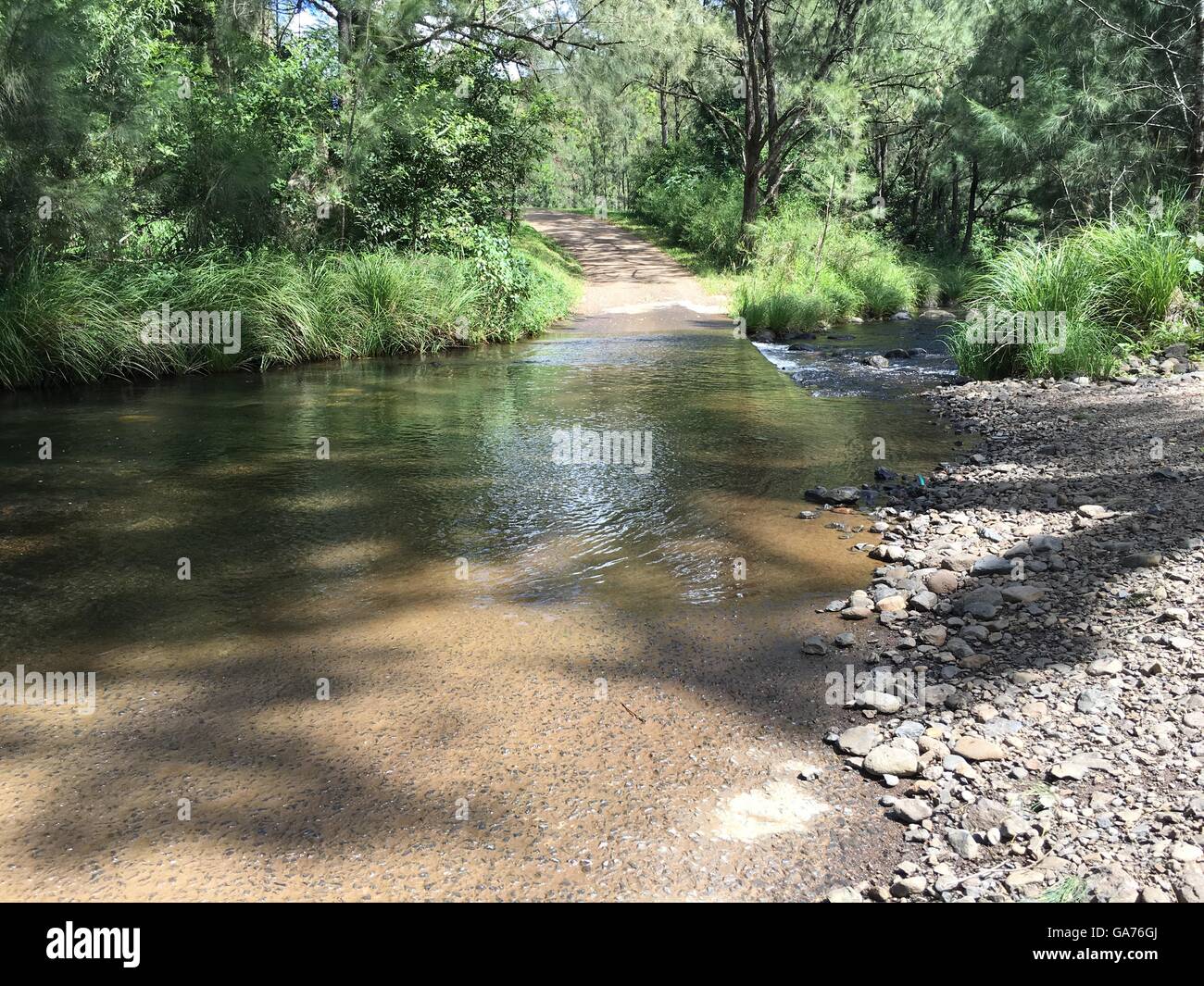 Stream Over Road Stock Photo - Alamy