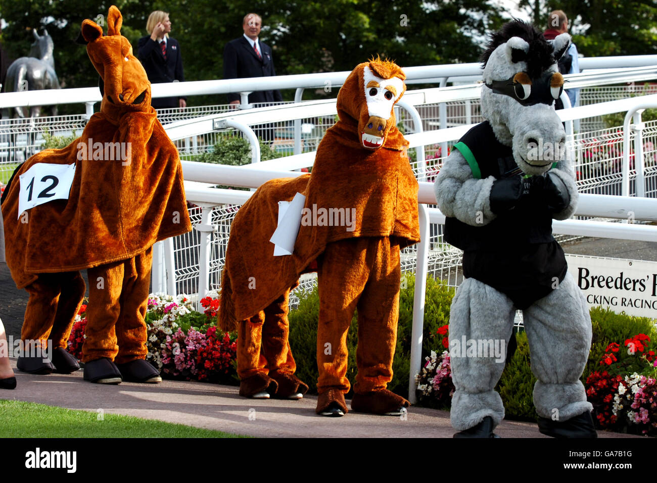 Pantomime horses parade in front of the crowds before the race Stock ...