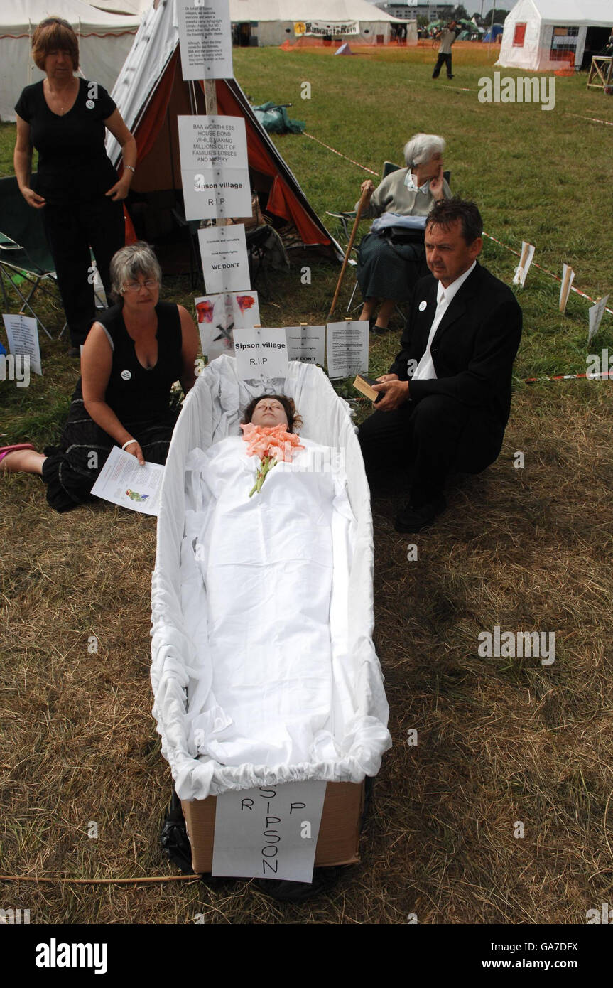 Campaigners and local residents hold a mock funeral at the climate ...