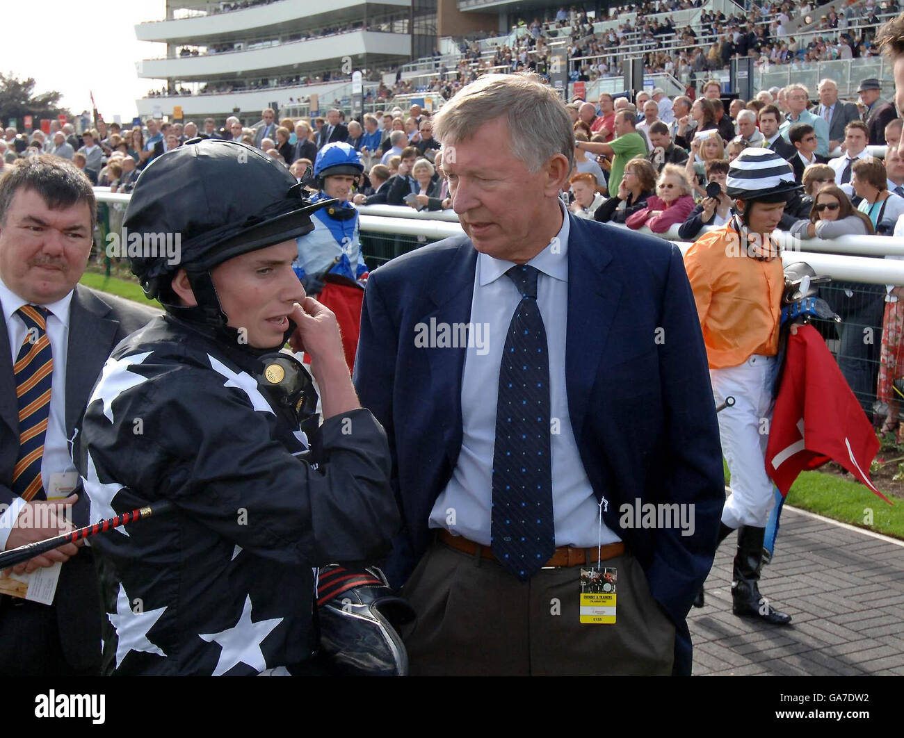 Sir Alex Ferguson talks with his jockey Ryan Moore after his horse ...