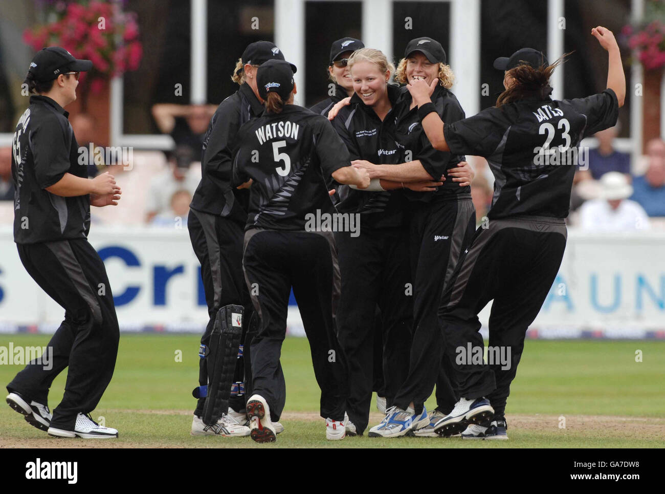 Aimee Mason (centre, facing camera) of New Zealand is mobbed by her ...