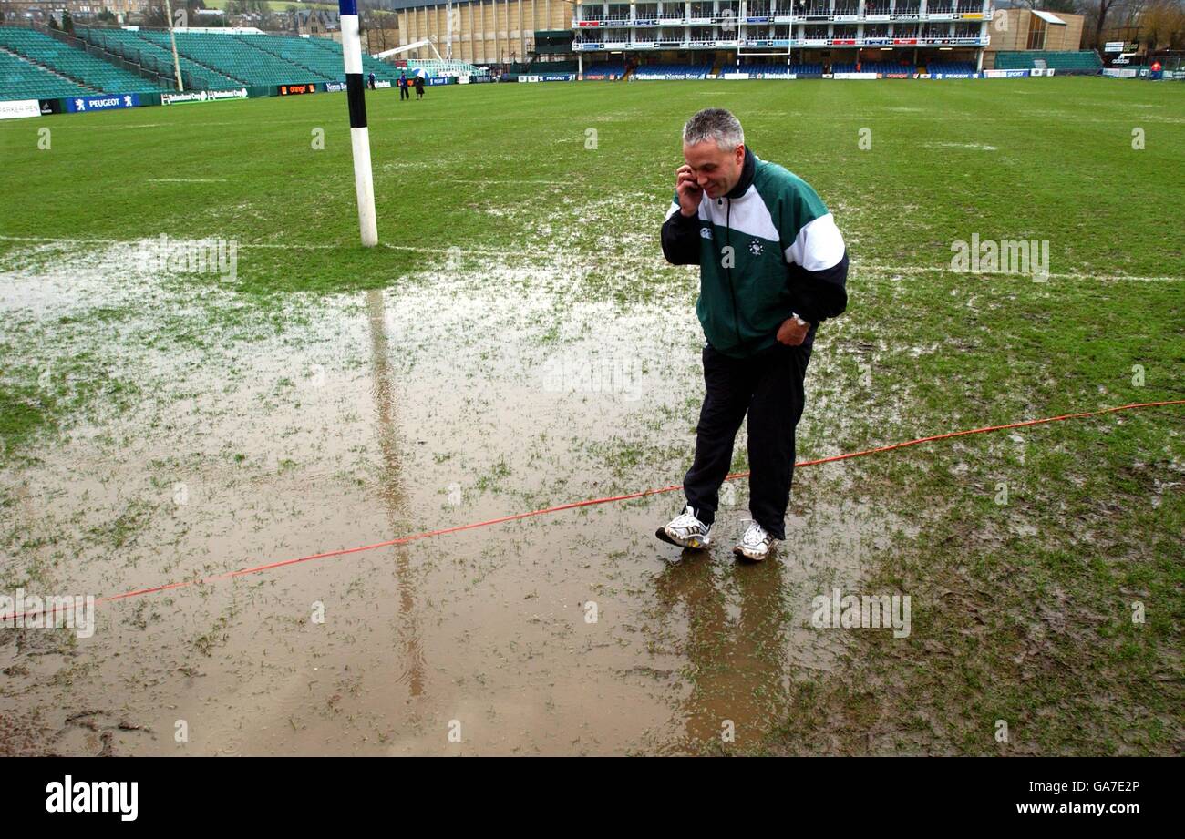 Referee Alan Lewis relays the news on his phone that he has called the ...