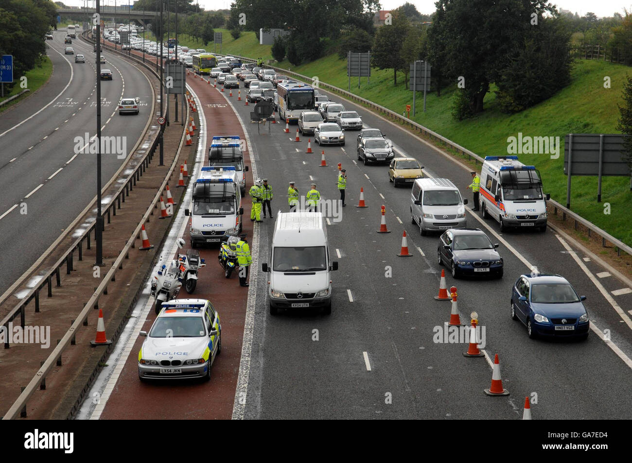 Police officers on the M4 spur road near Heathrow airport, which is ...