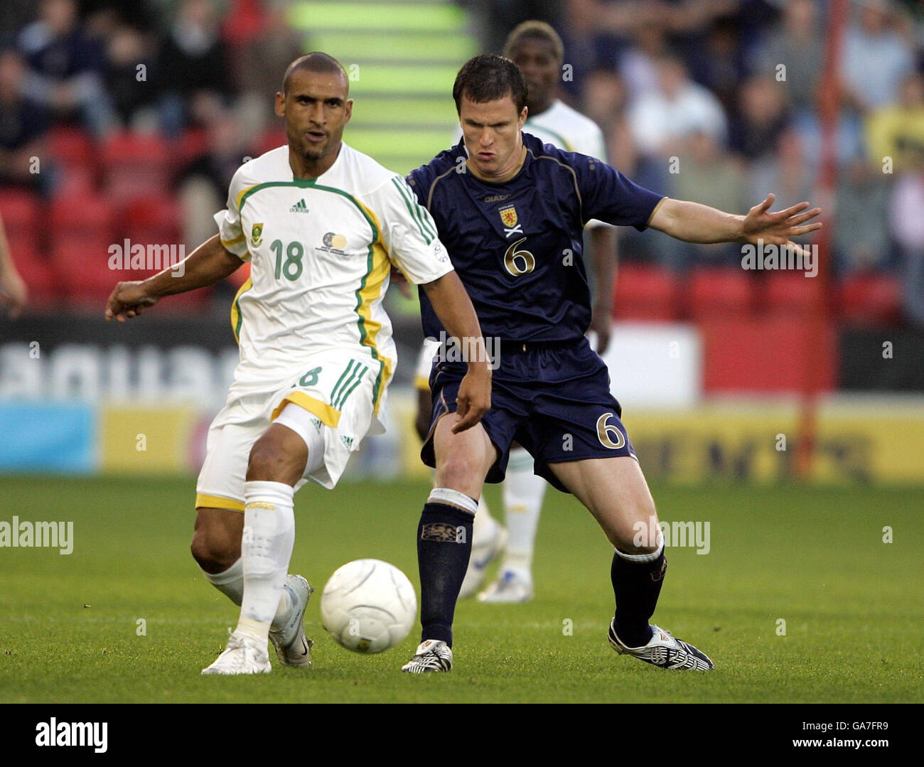 Scotland's Gary Caldwell challenges South Africa's Delron Buckley ...