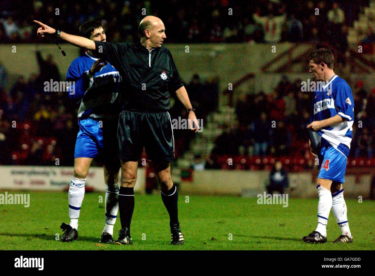Reading's Sammy Igoe is shown the way off the pitch by referee Barry ...