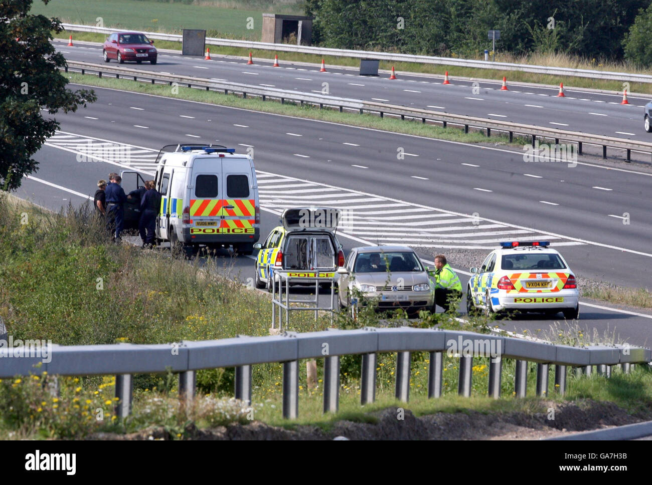 Police cars officers close hi-res stock photography and images - Alamy