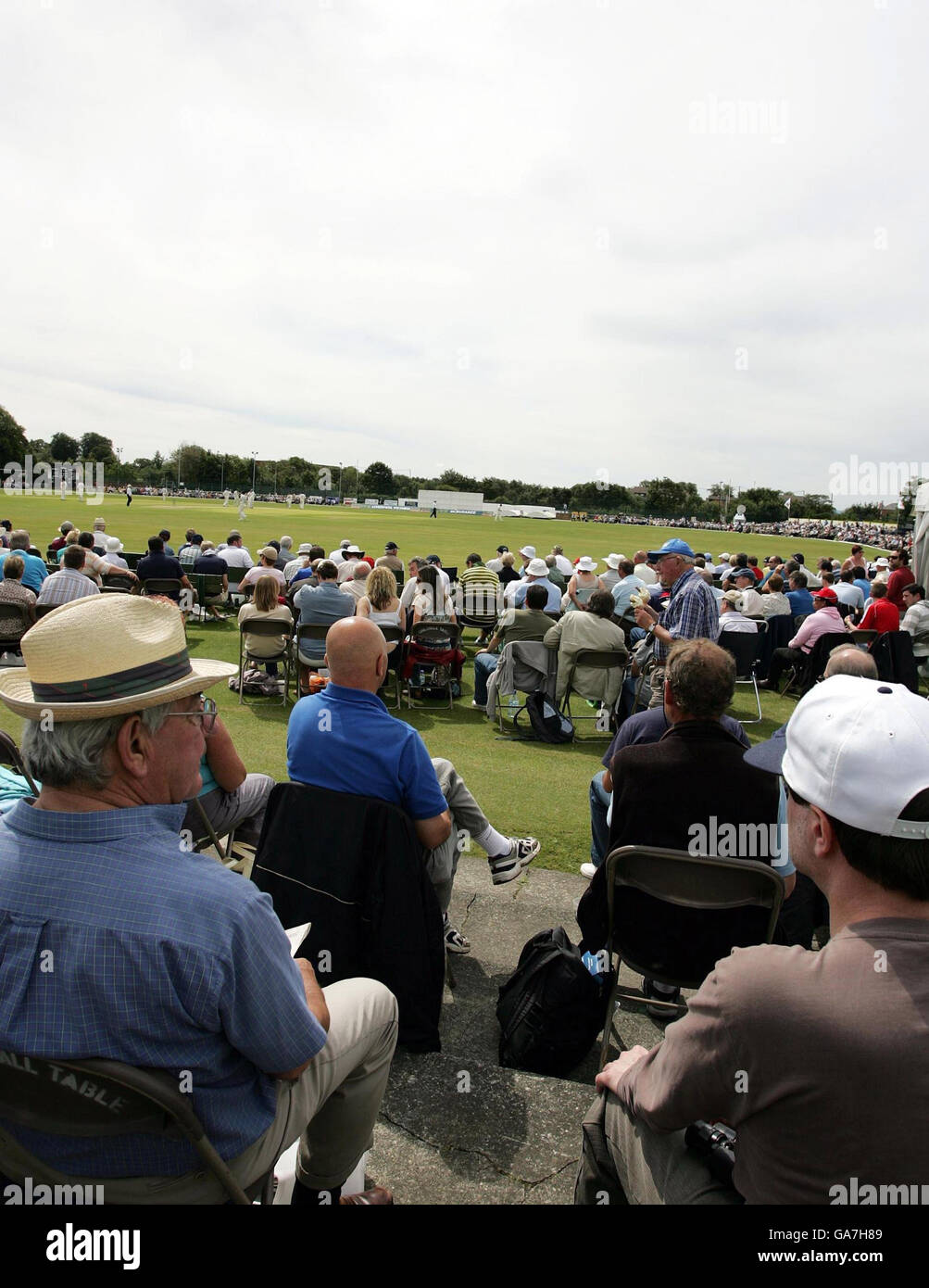 Spectators fill the ground to enjoy the sunshine and cricket during the ...