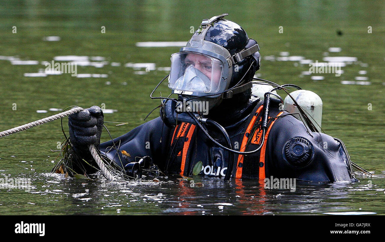Police divers in a lake near Whickham, Newcastle today after a farmer ...