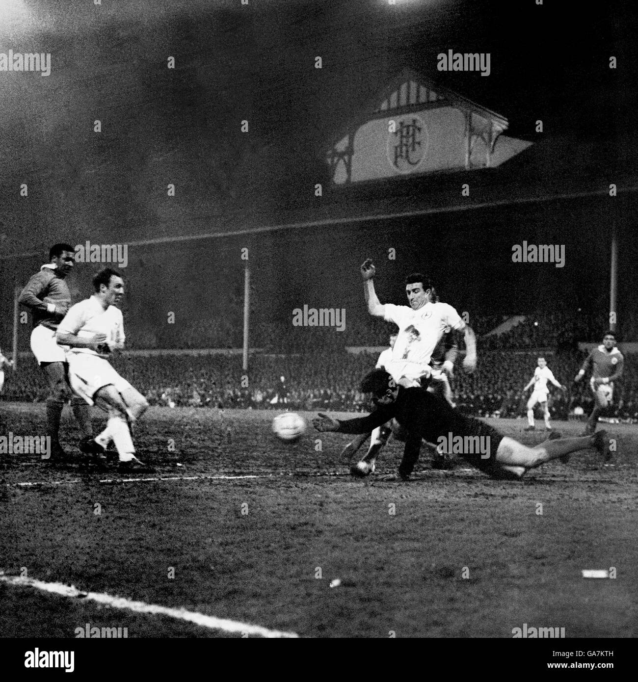 Goalkeeper Pereira of Benfica dives at the feet of Spurs attackers ...