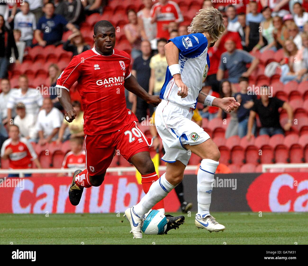 Blackburn Rovers' Robbie Savage (r) and Middlesbrough's Ayegbeni Yakubu ...