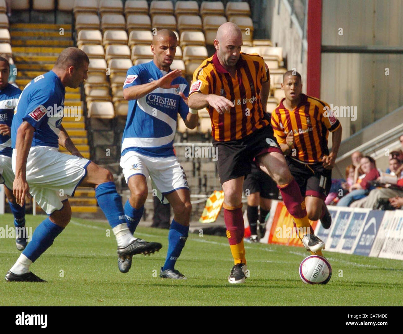 Bradford's Barry Conlon takes on Macclesfield's Carl Regan (centre) and ...