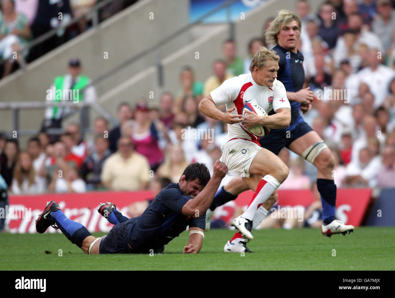 Full length action tackling running ball england mangrk hi-res stock ...