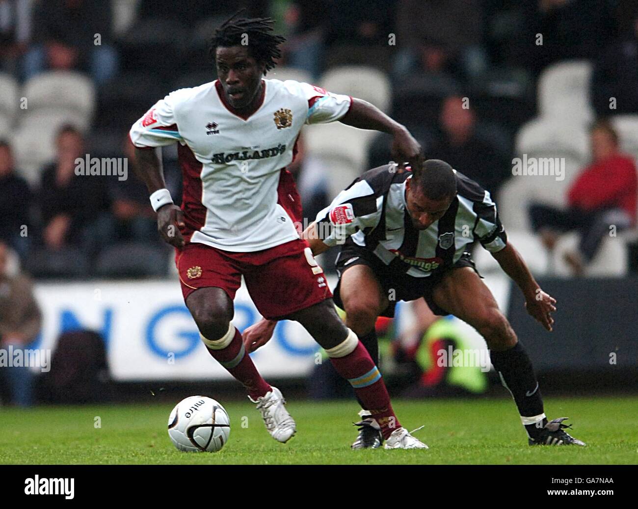 Justin Whittle, Grimsby Town (r) and Ade Akinbiyi, Burnley (l) battle ...