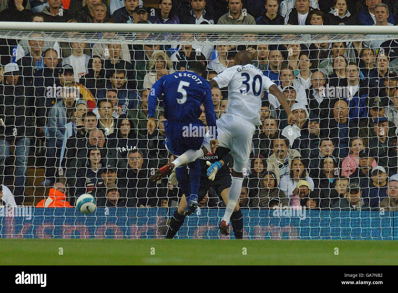 Everton's Joleon Lescott heads in the first goal as he battles for the ...