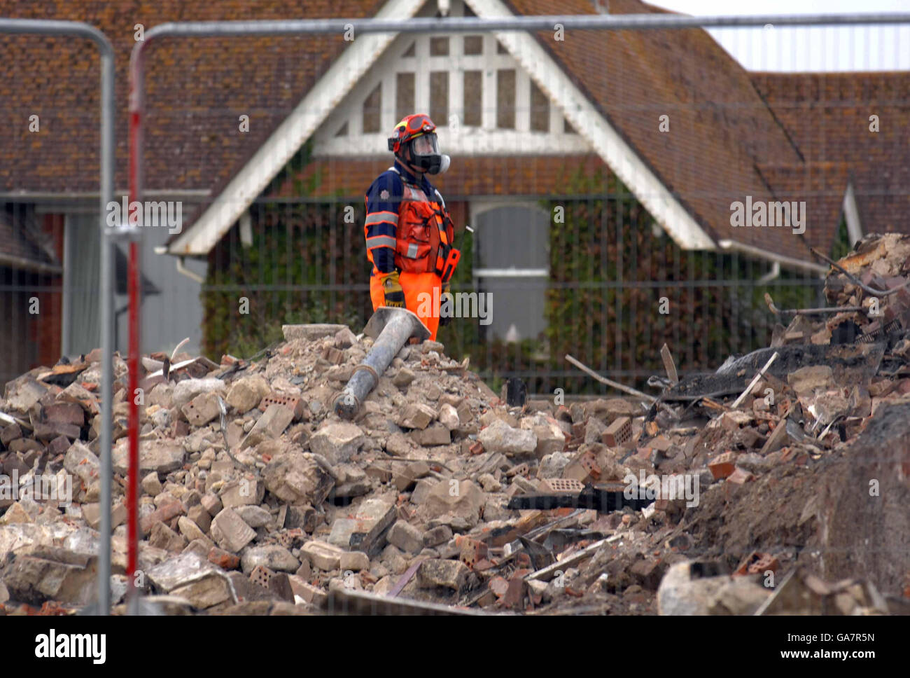 A demolition worker surveys the rubble surrounding the Penhallow Hotel ...