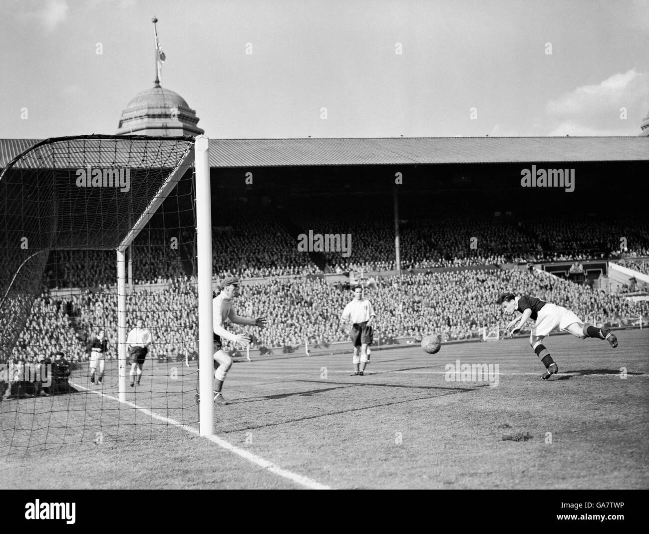 Scotland's Lawrie Reilly (r) heads the ball past England goalkeeper ...