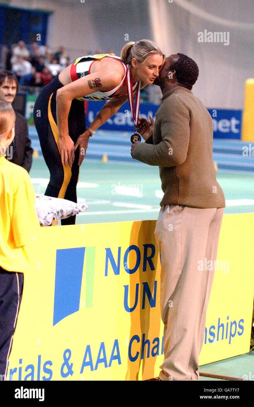 Catherine Murphy receives her medal from Linford Christie Stock Photo ...