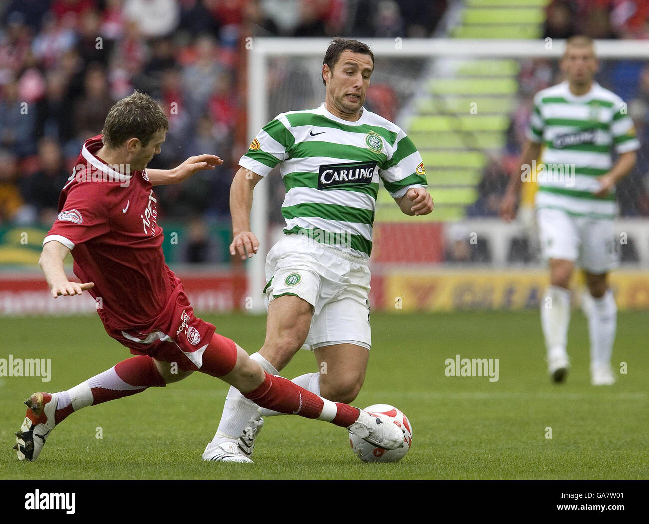 Aberdeen's Zander Diamond (left) tackles Celtic's Scott McDonald during ...