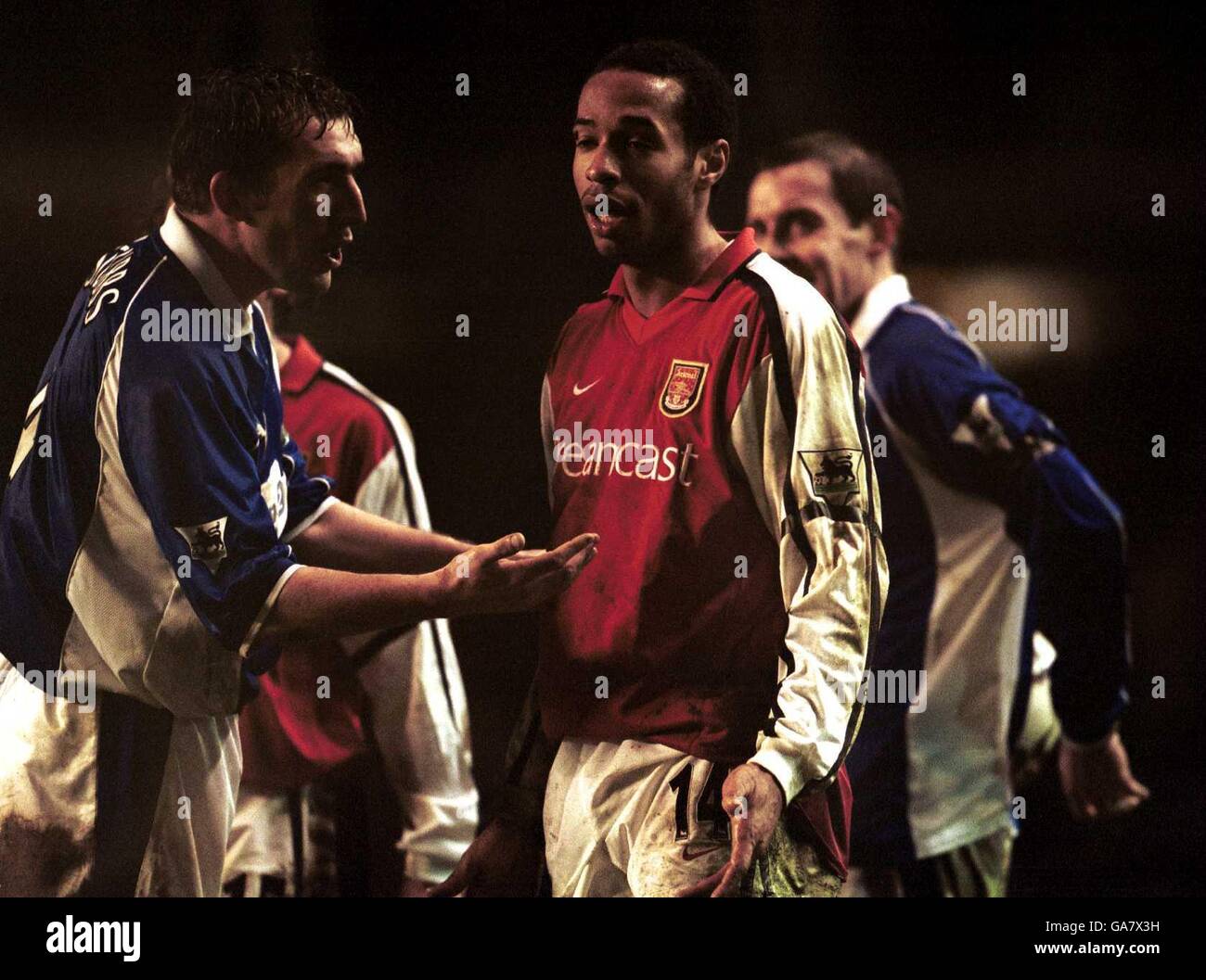 Everton's Alan Stubbs makes his point to Arsenal's Thierry Henry after ...
