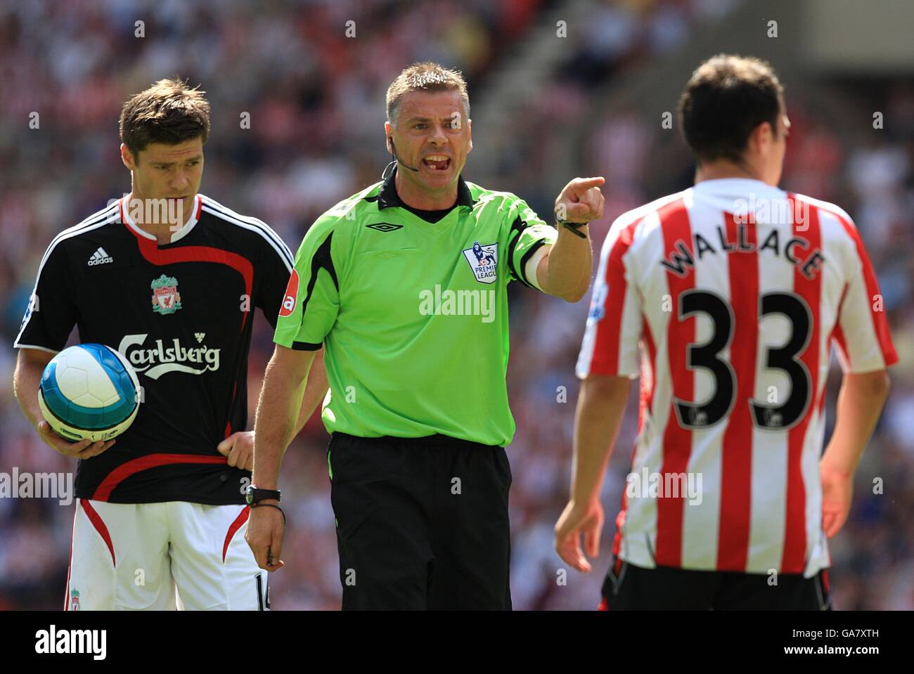 Referee Mark Halsey has words with Sunderland's Ross Wallace Stock ...