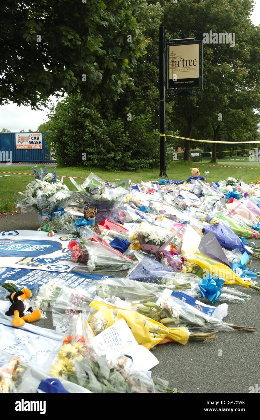 Flowers laid outside the Fir Tree pub, Croxteth Park, in memory of ...