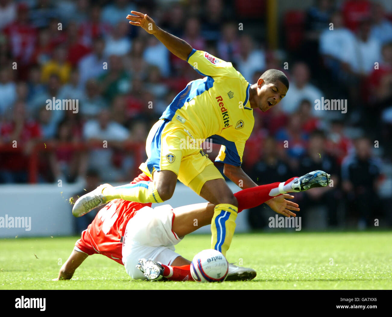 Nottingham Forest's Kelvin Wilson and Leeds United's Jermaine Beckford ...