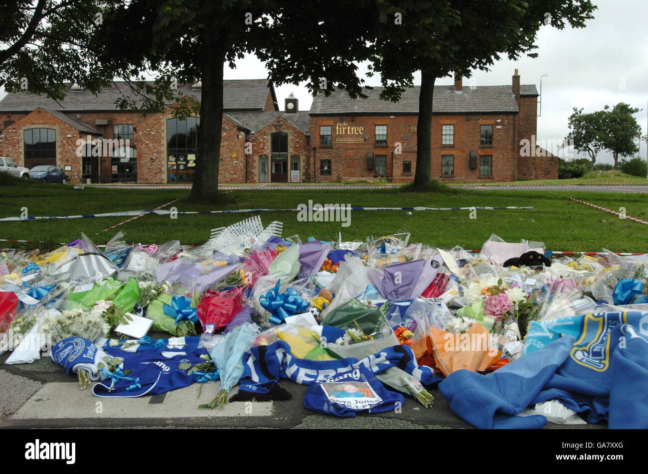 Flowers laid outside the Fir Tree pub, Croxteth Park, in memory of ...