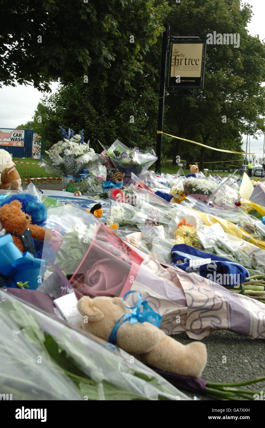 Flowers laid outside the Fir Tree pub, Croxteth Park, in memory of ...