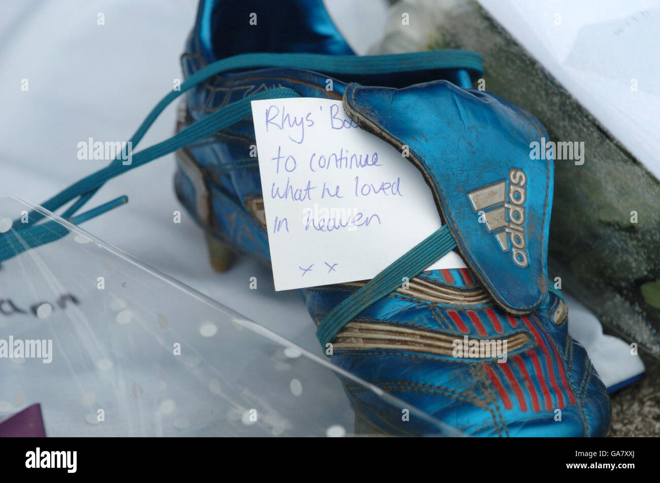 Boy shot in Liverpool. Tributes on flowers laid outside the Fir Tree ...