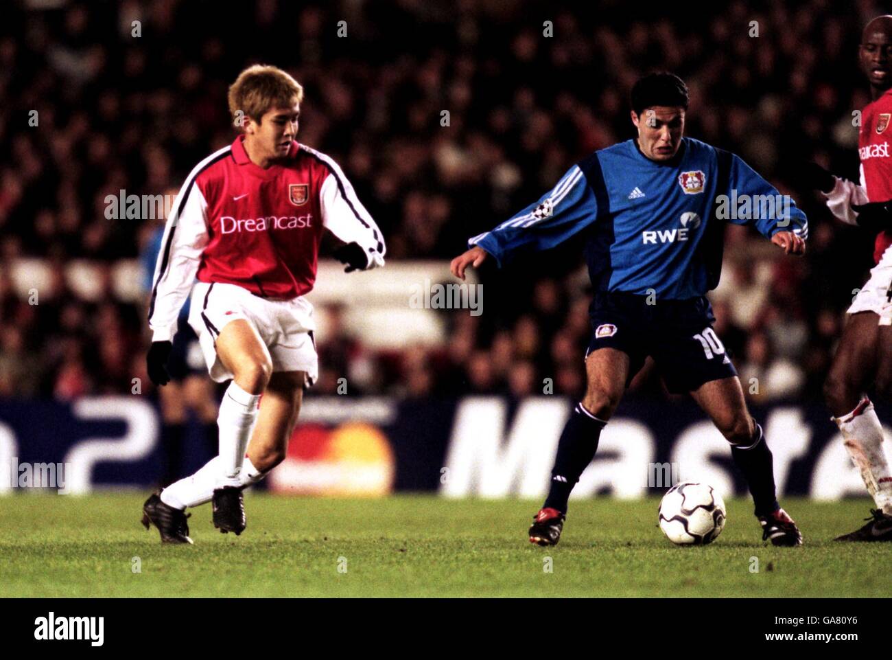 Arsenal's Junichi Inamoto and Bayer Leverkusen's Yildiray Basturk Stock ...